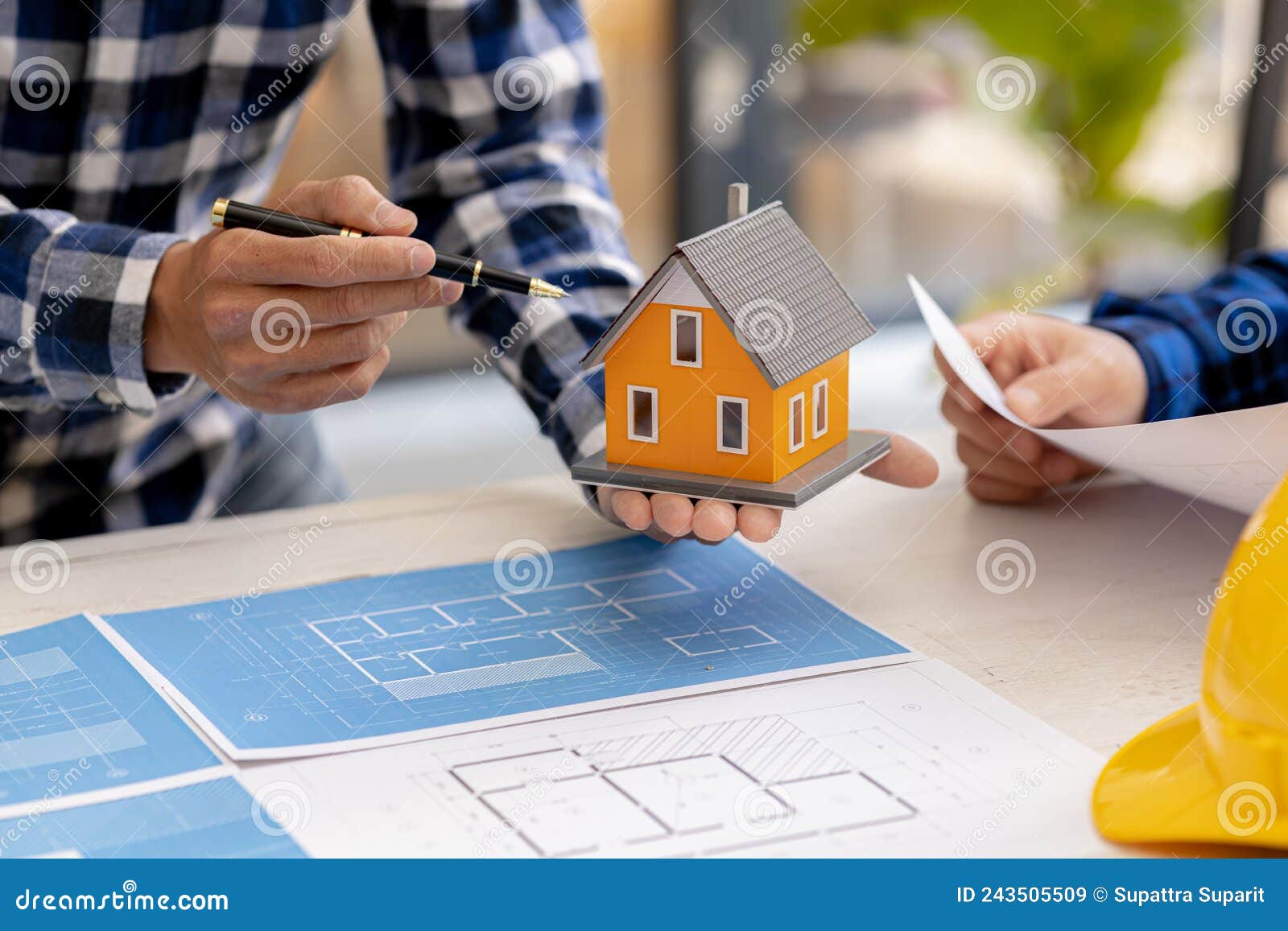 Architects Design Team is Looking at Models of Small Houses, Architect ...