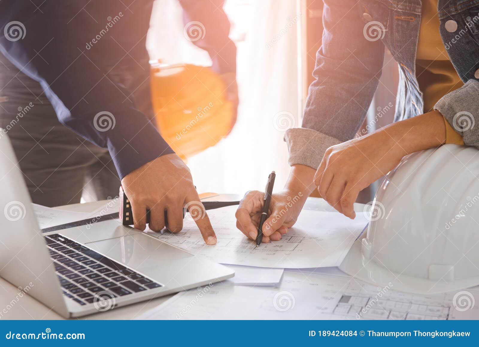 Architects are Discussing and Planning Together at the Desk with ...