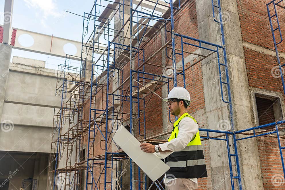Architect Engineer is Checking the Progress of the Building Project and ...