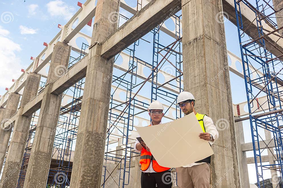 Architects Engineer are Checking the Progress of the Building Project ...
