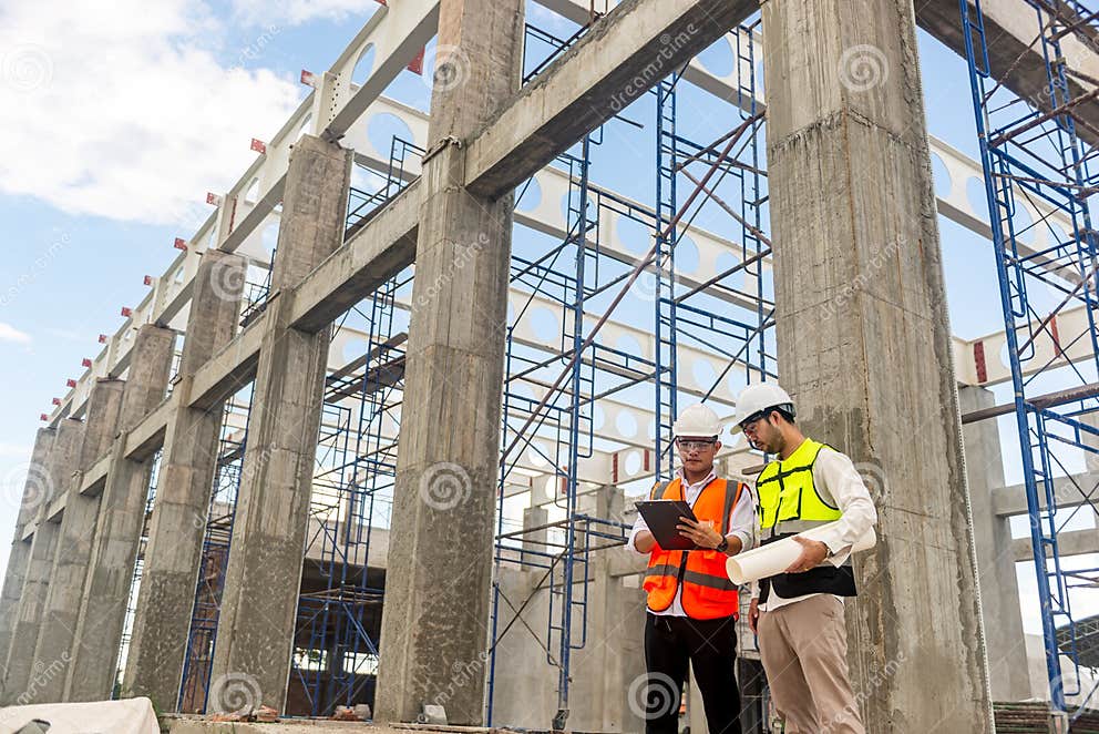 Architects Engineer are Checking the Progress of the Building Project ...