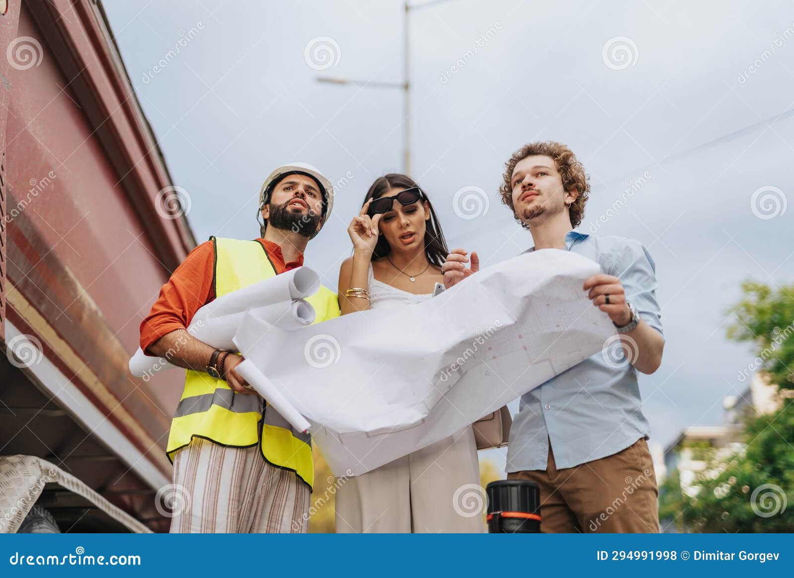 Collaborative Architectural Team Strategizing Sustainable Design for ...