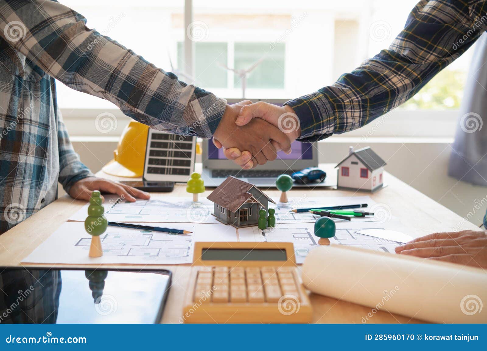 Architects and Engineers Join Hands To Congratulate when Discussing and ...