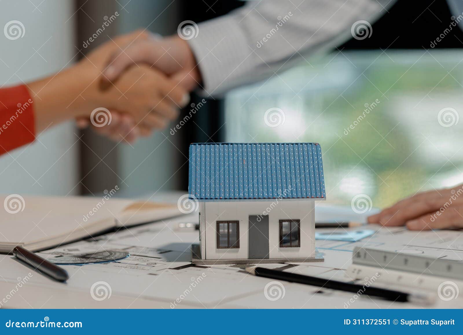 Architects and Engineers Shake Hands As the Work they Ve Done Together ...