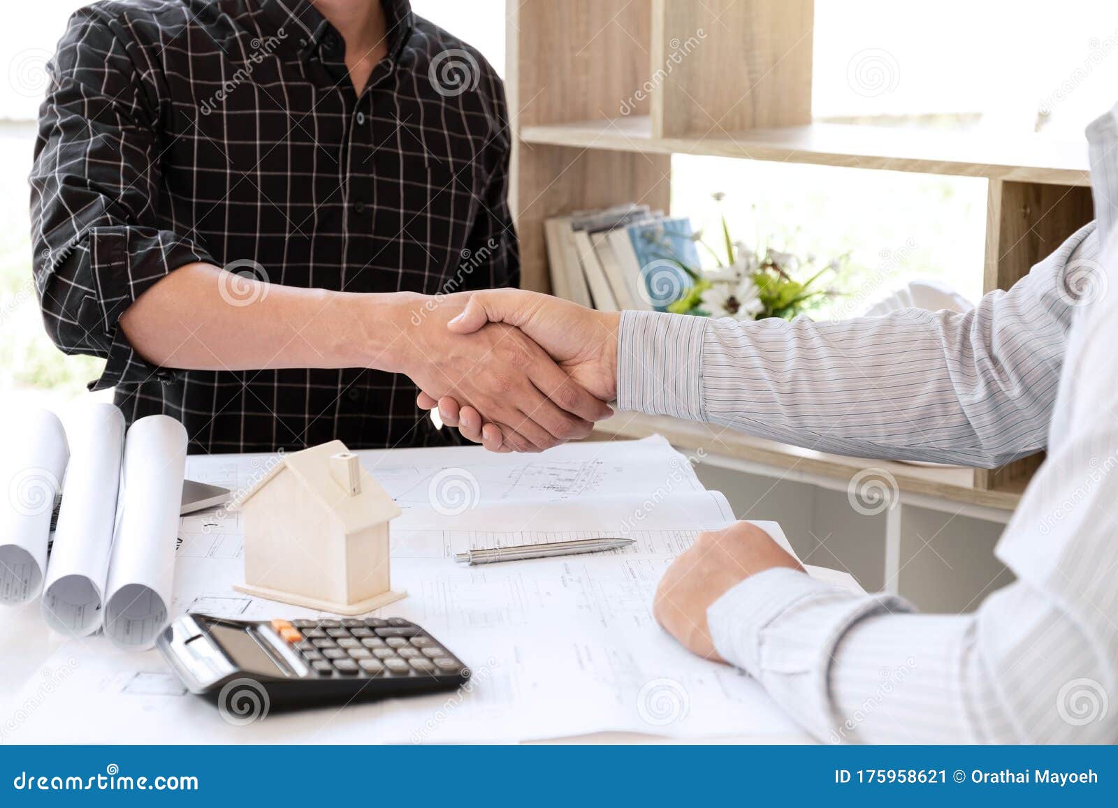 Architects and Engineers Shake Hands while Working for Teamwork ...