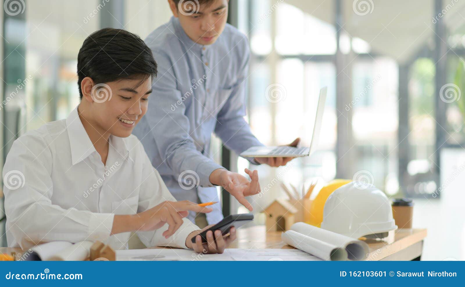 Architects and Engineers Use Calculators and Laptop To Design and Plan ...