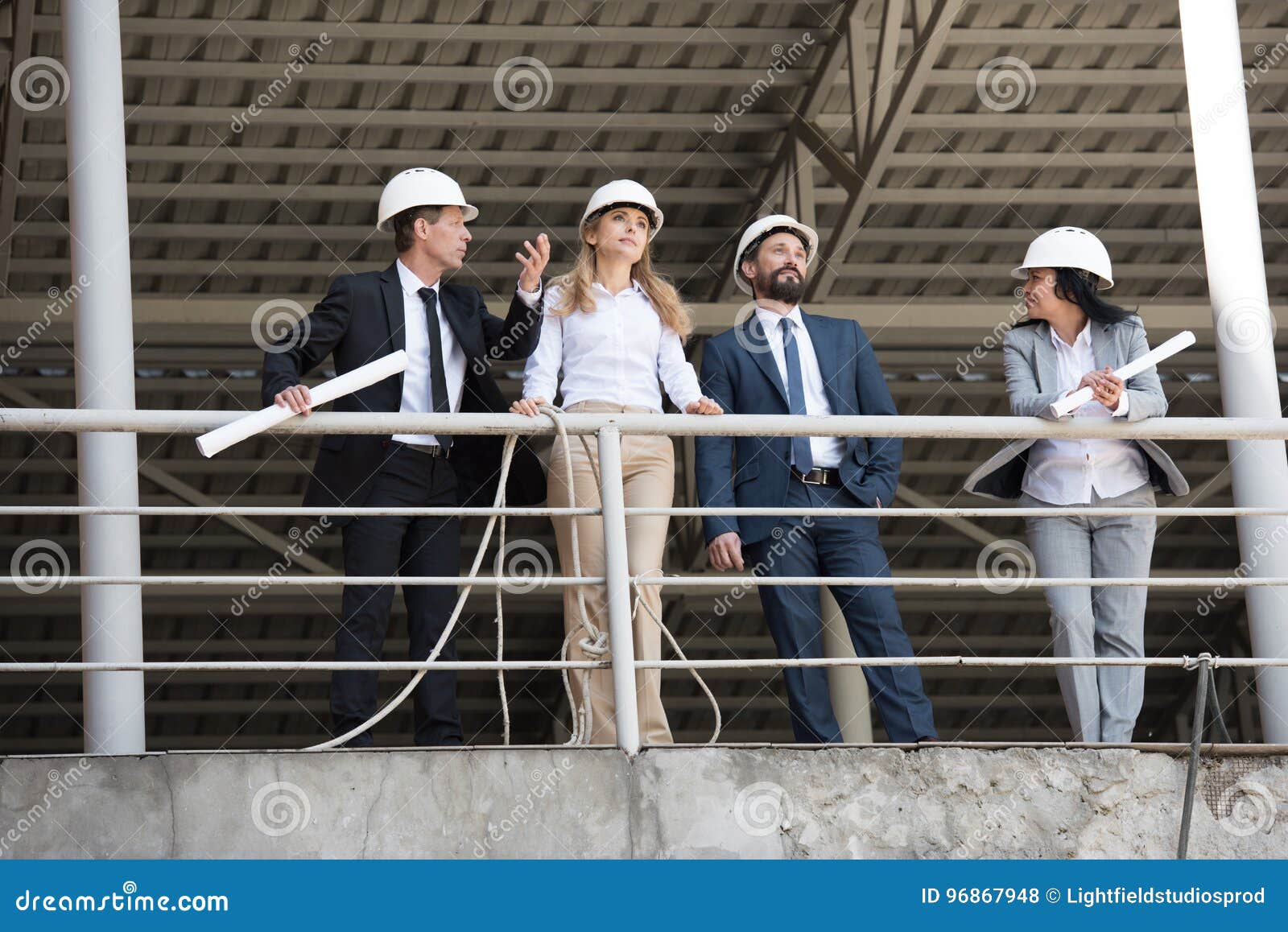 Architects in Formal Wear Talking while Standing at Construction Site ...