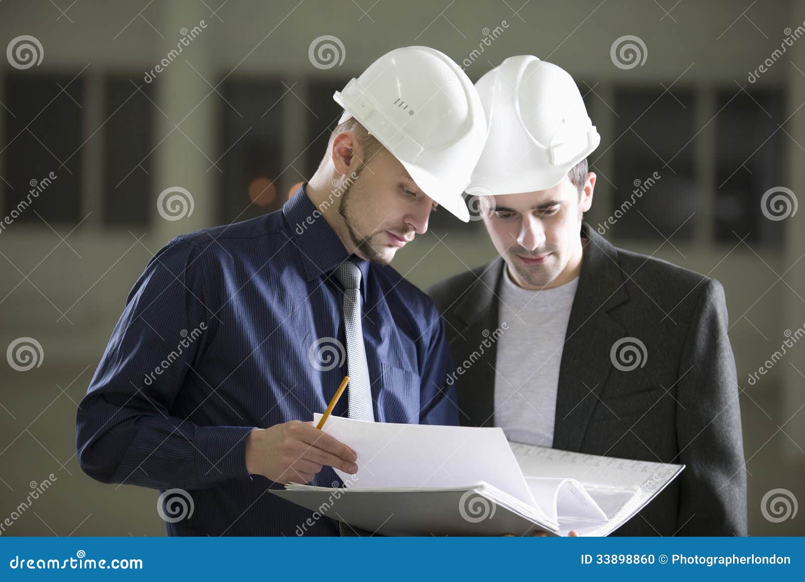 Architects Going through File Folder in Warehouse Stock Photo - Image ...