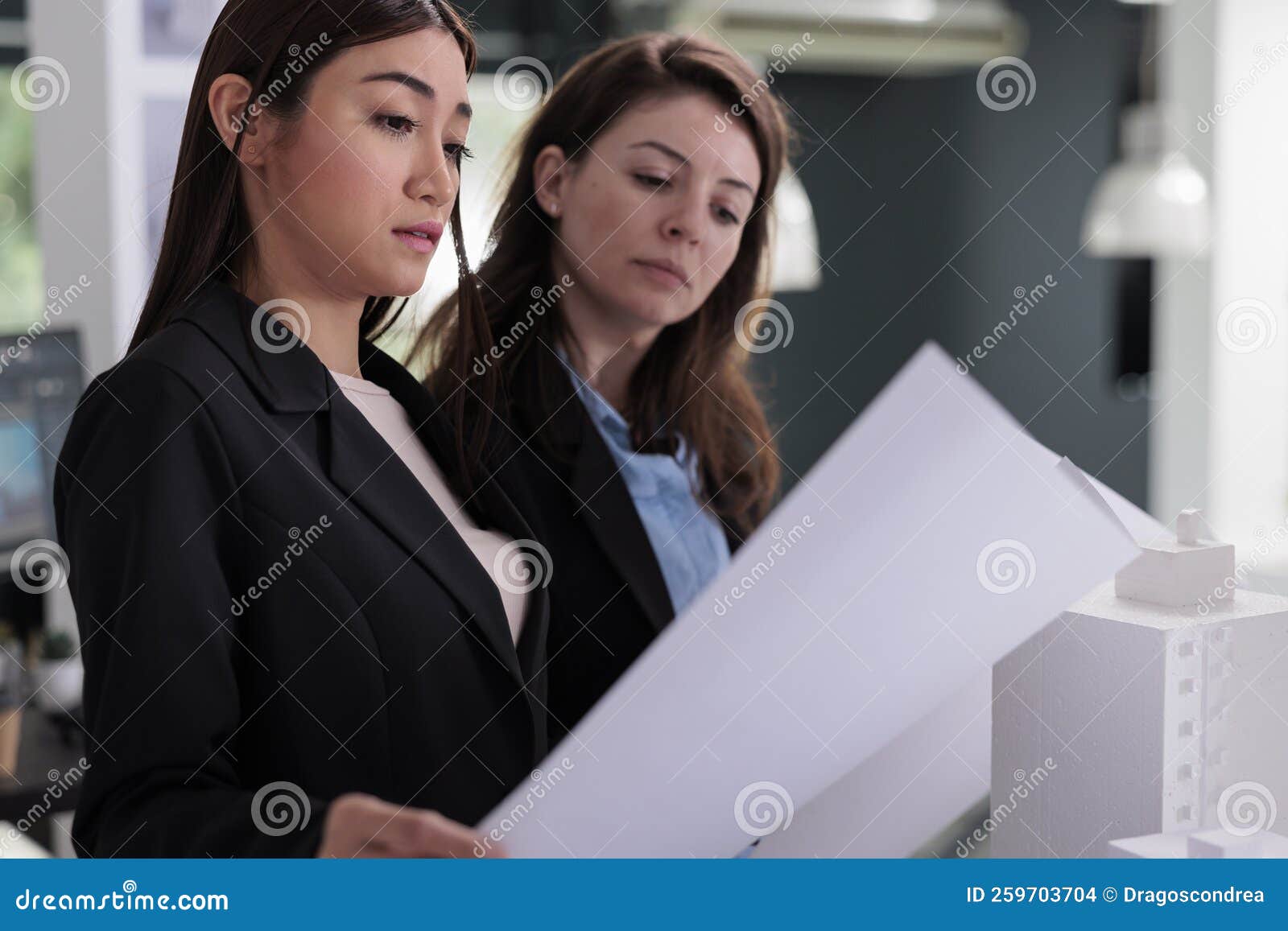 Architects Looking at Blueprint, Working on Building Construction Draft ...