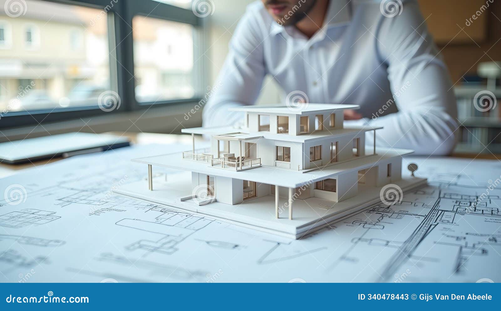Architects Office with Detailed Blueprints and a Scale Model of a ...