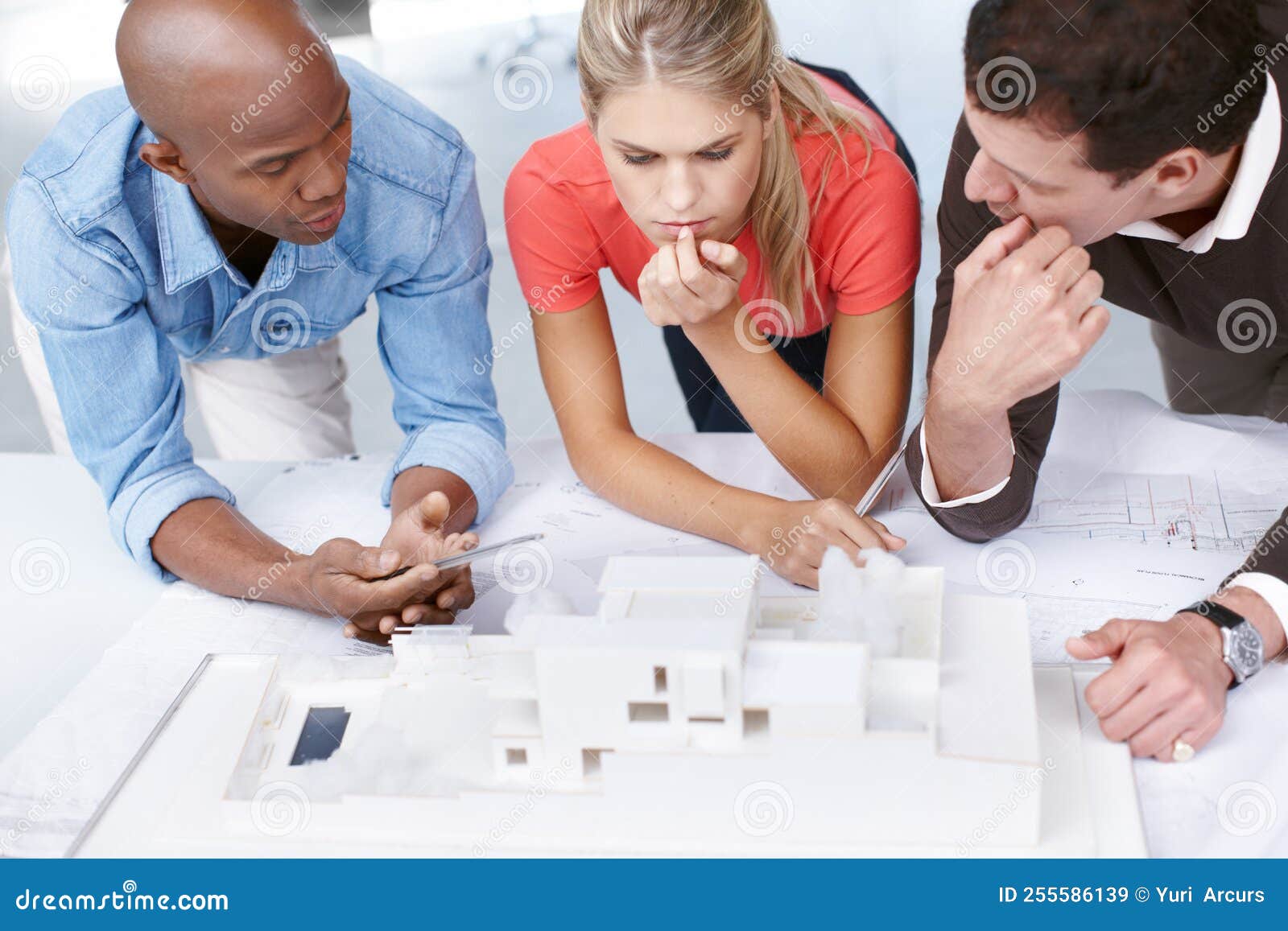 At the Architects Table...a Group of Architects Working Together on an ...