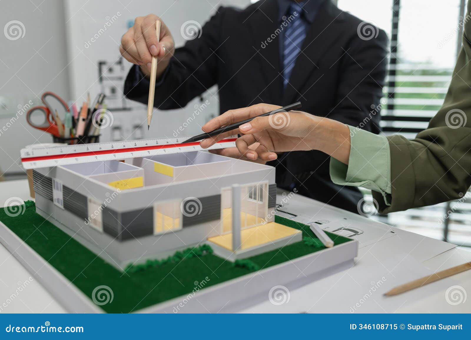 Architects Work with Engineers and Contractors in the Office To Check ...