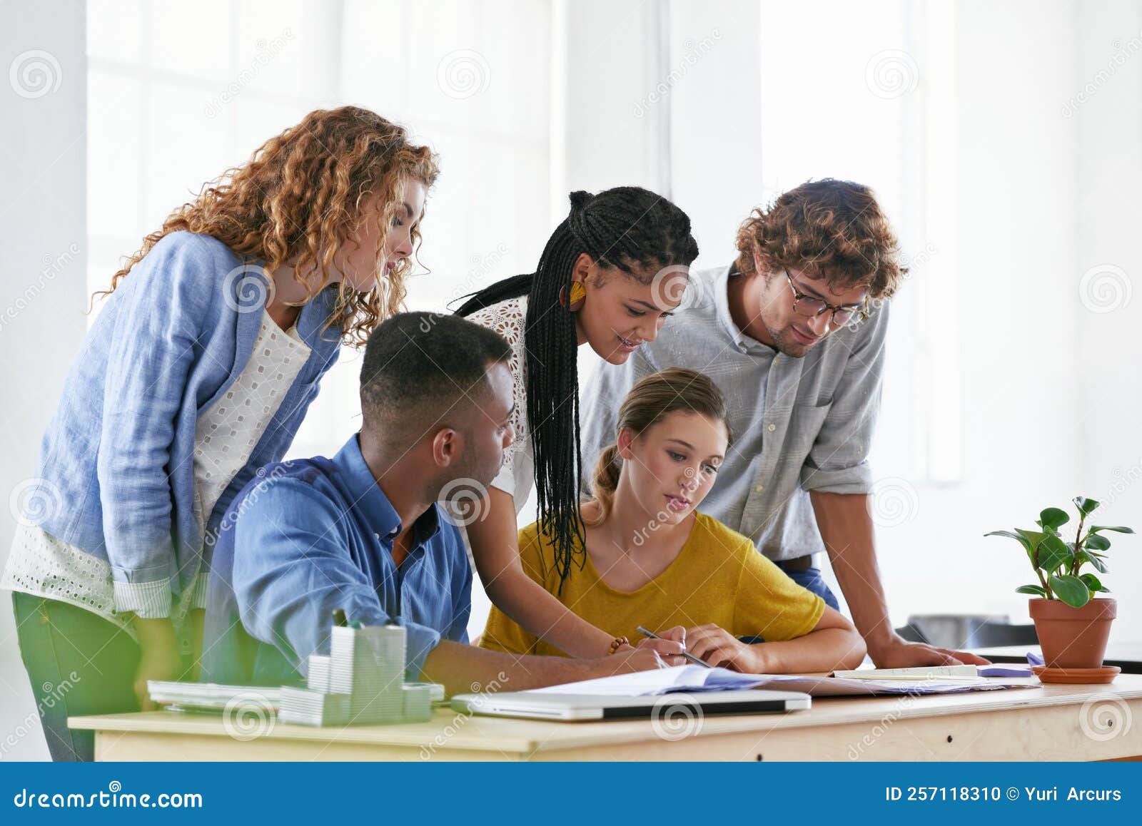 Architects at Work. a Group of Young Architects Working Together on a ...