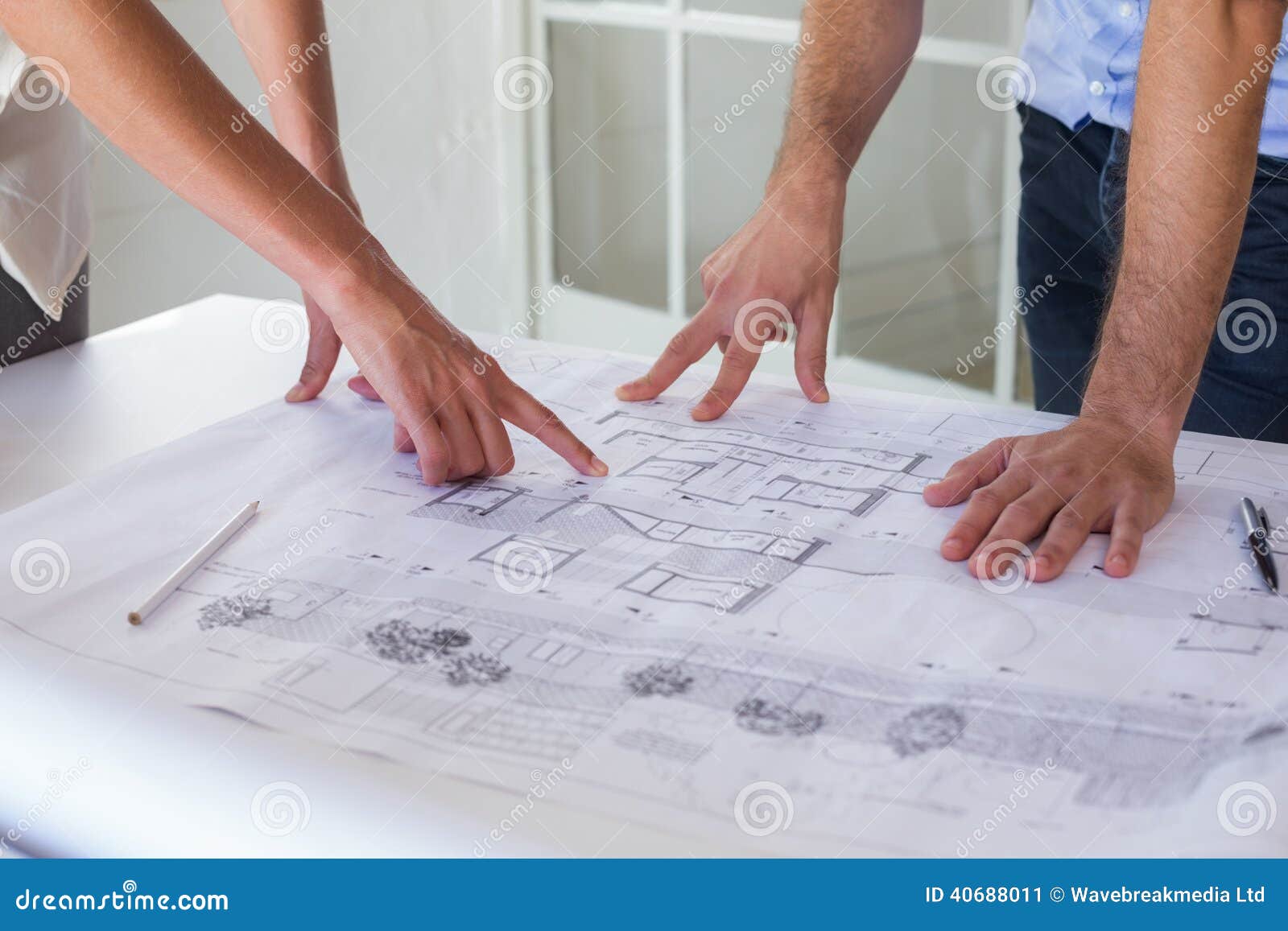 Architects Working on Blueprints Together Stock Image - Image of woman ...