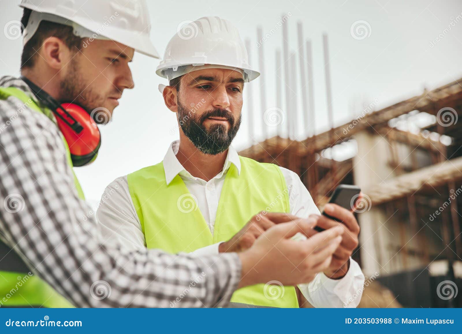 Architects Working with Smartphone on Construction Site Stock Photo ...