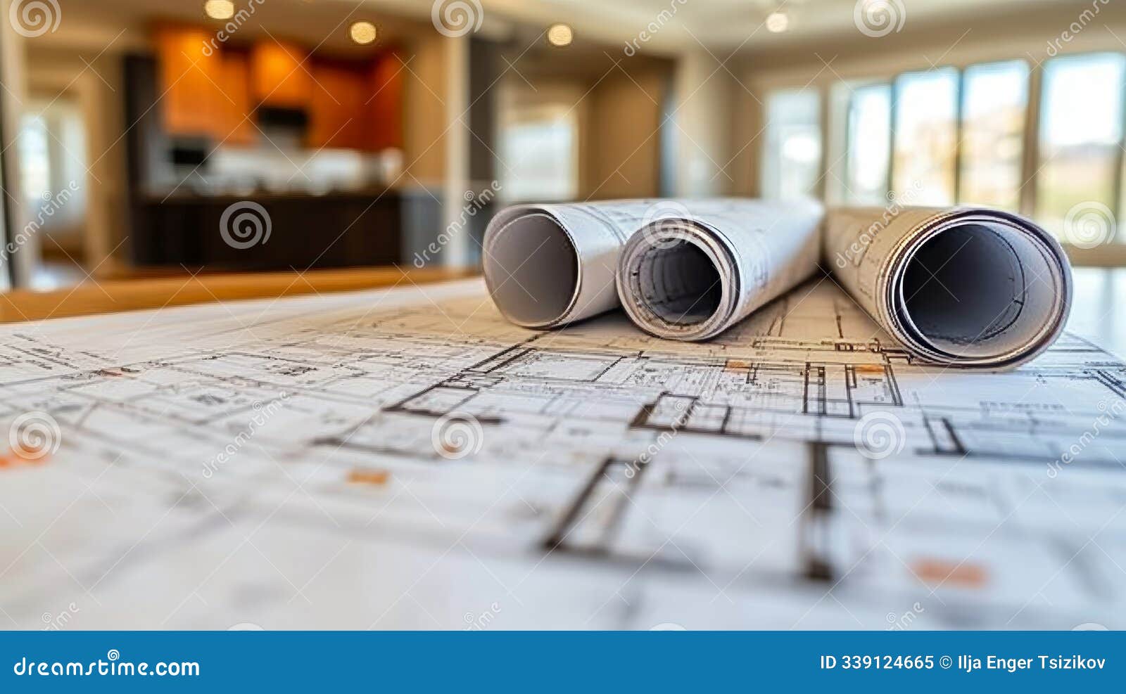 Architectural Blueprints on Table with Kitchen in Background Showing ...