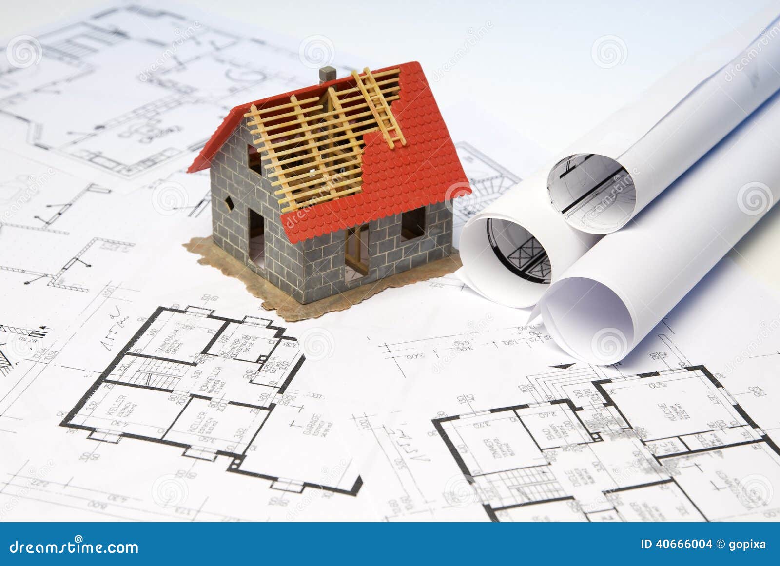 Architectural Model of a Building Shell on Blueprints Stock Photo ...