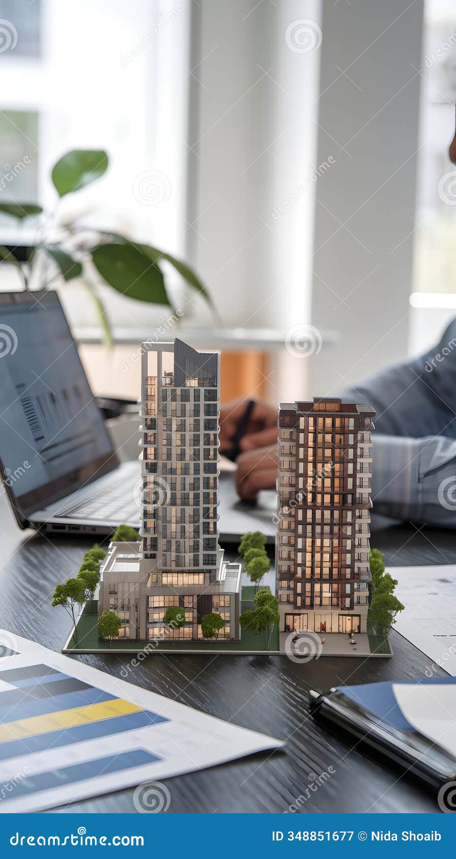 Architectural Models and Laptop on Desk, Showcasing Ongoing Design Work ...