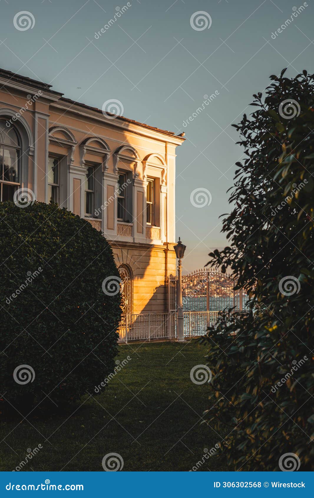 Architectural Structure Featuring an Arched Window, Surrounded by Lush ...