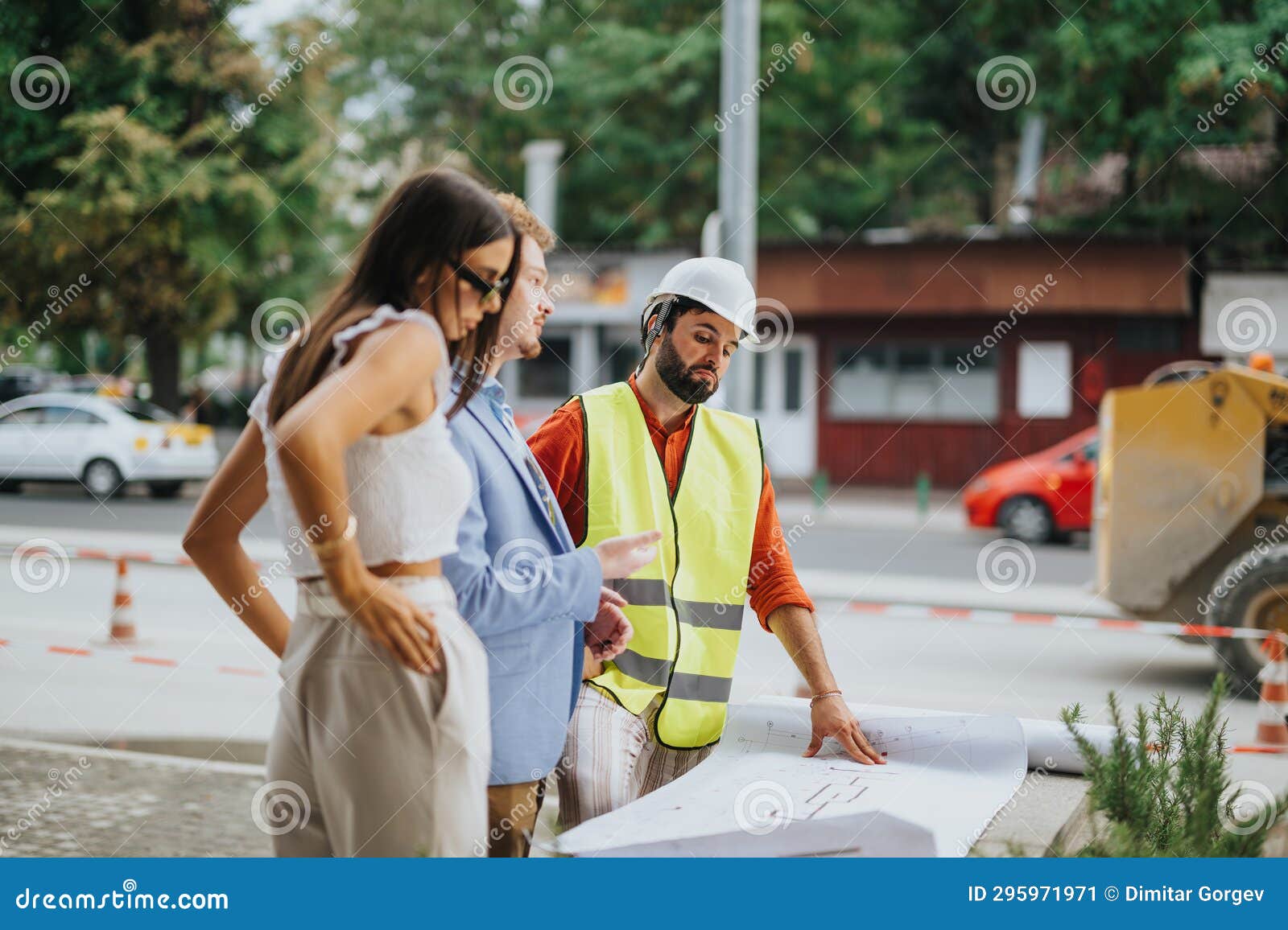 Architectural Team Discussing Project Design Outdoors with Successful ...
