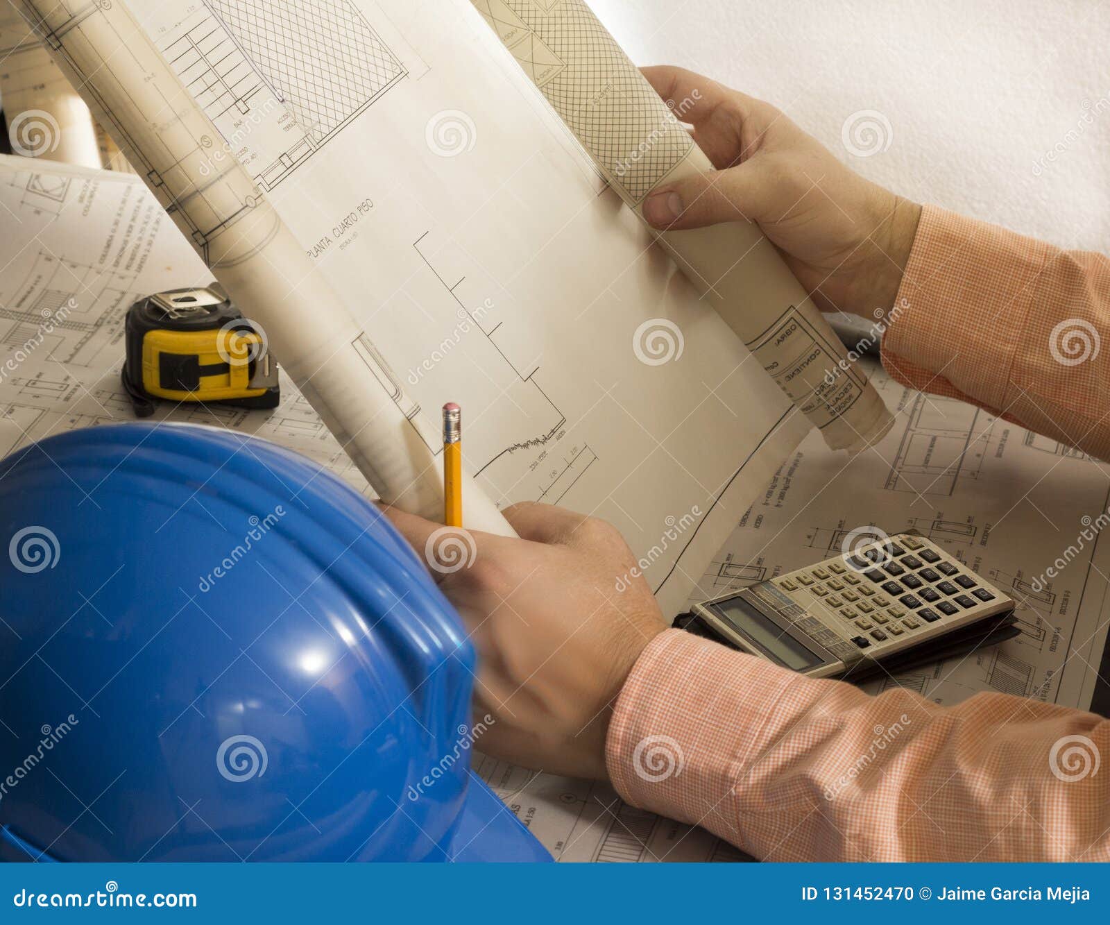 Architectural Plans of Construction- Engineer-architect Reviewing Plans ...