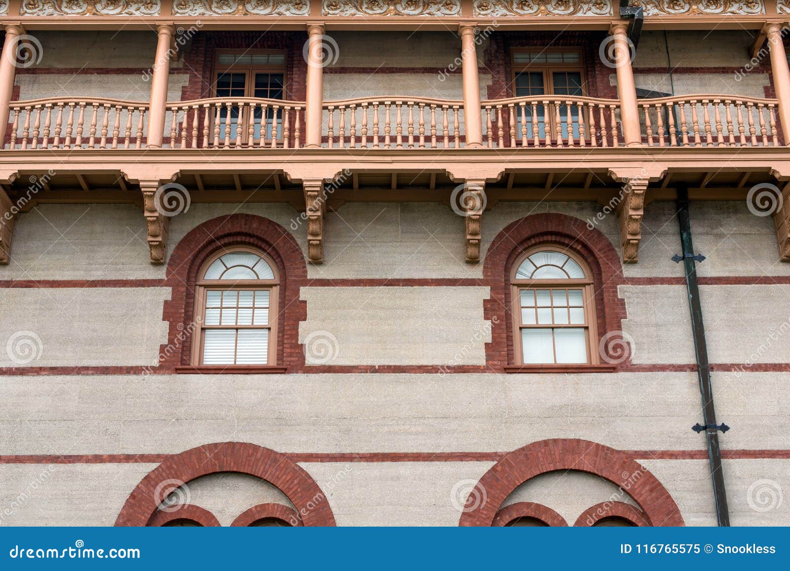 Architecture of Brick Outlined Windows and Wooden Balcony Stock Image ...
