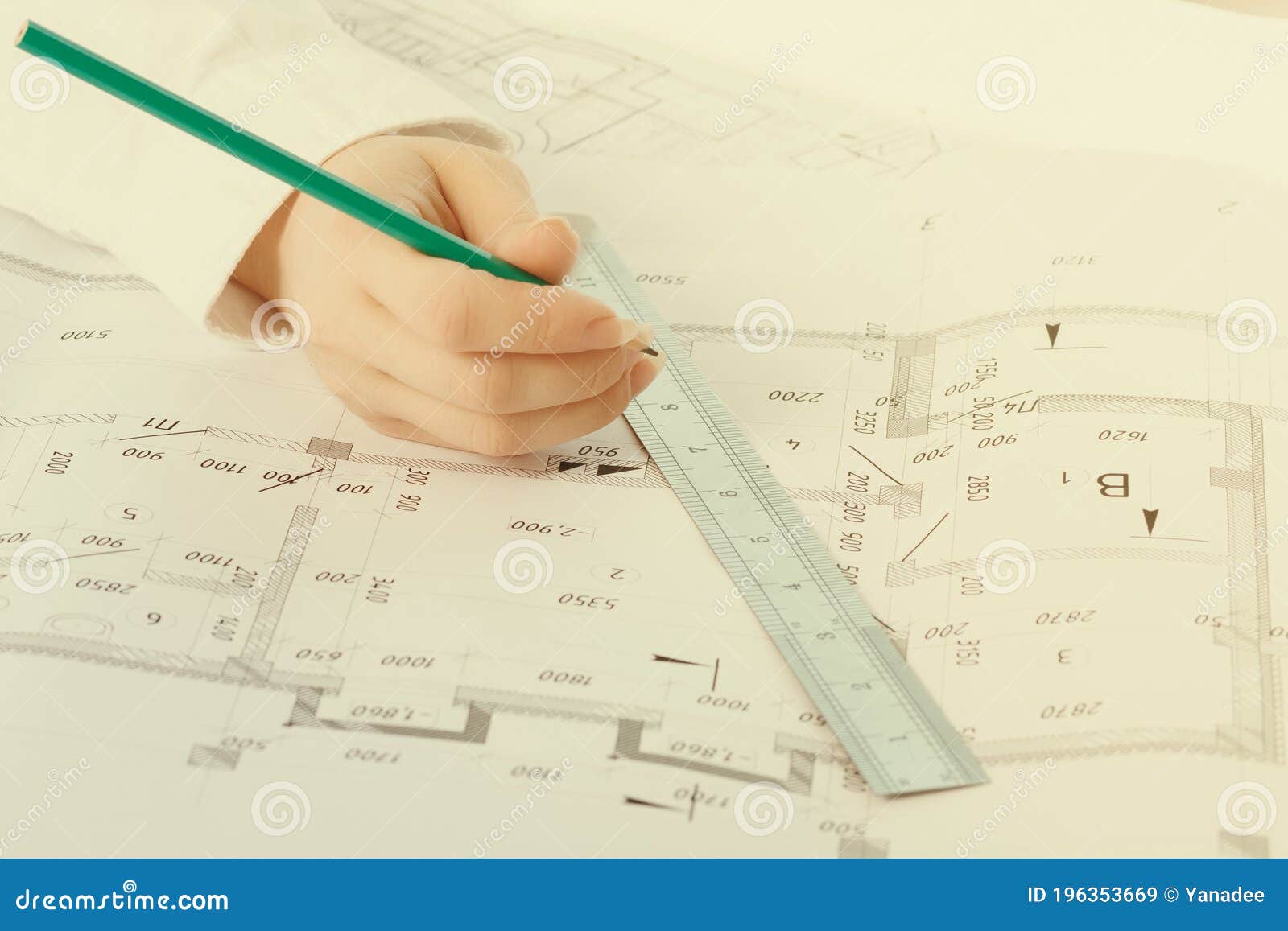 Architecture and Construction. an Architect Draws a Plan in an ...