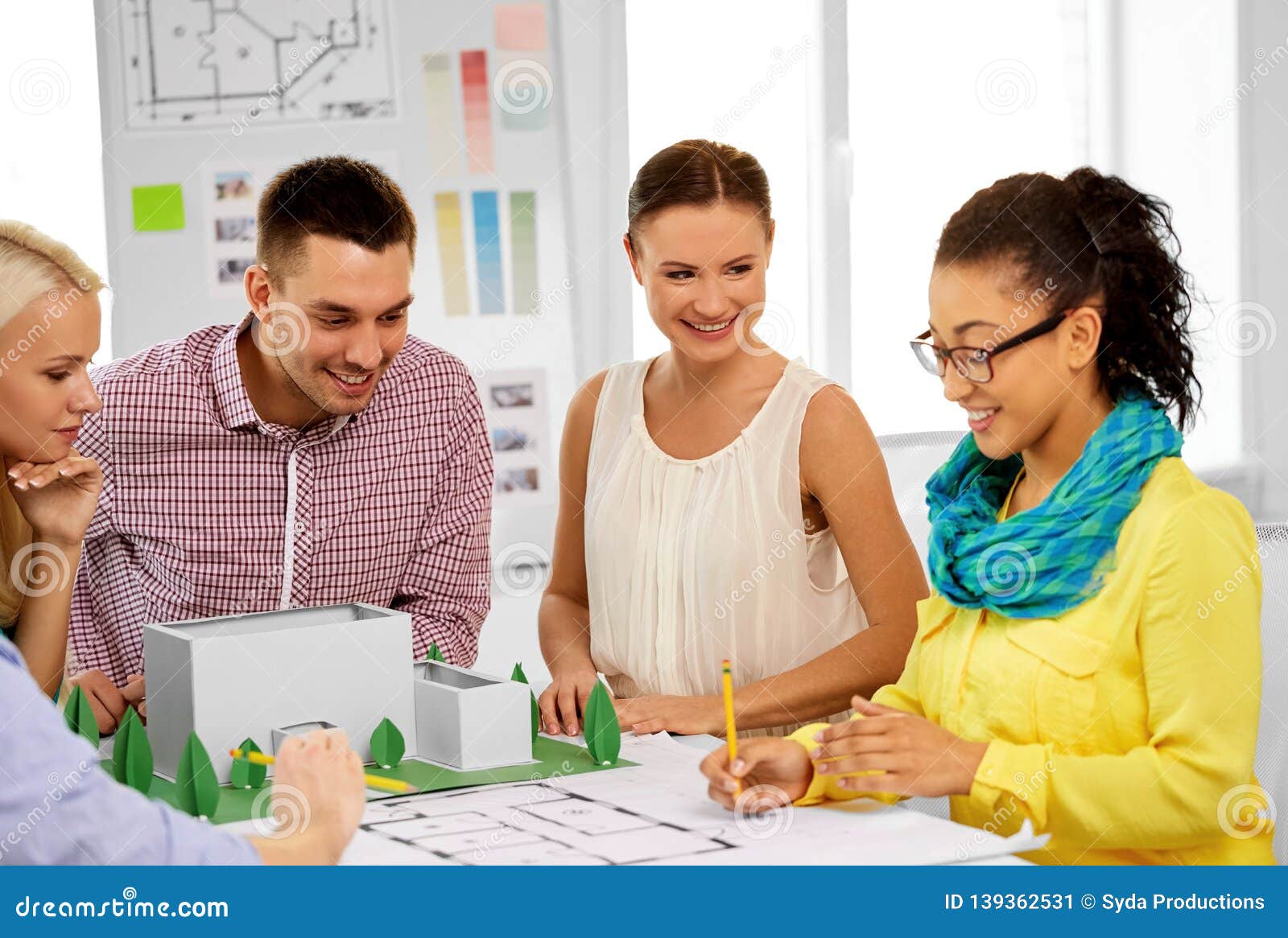 Creative Team with Blueprint Working at Office Stock Image - Image of ...