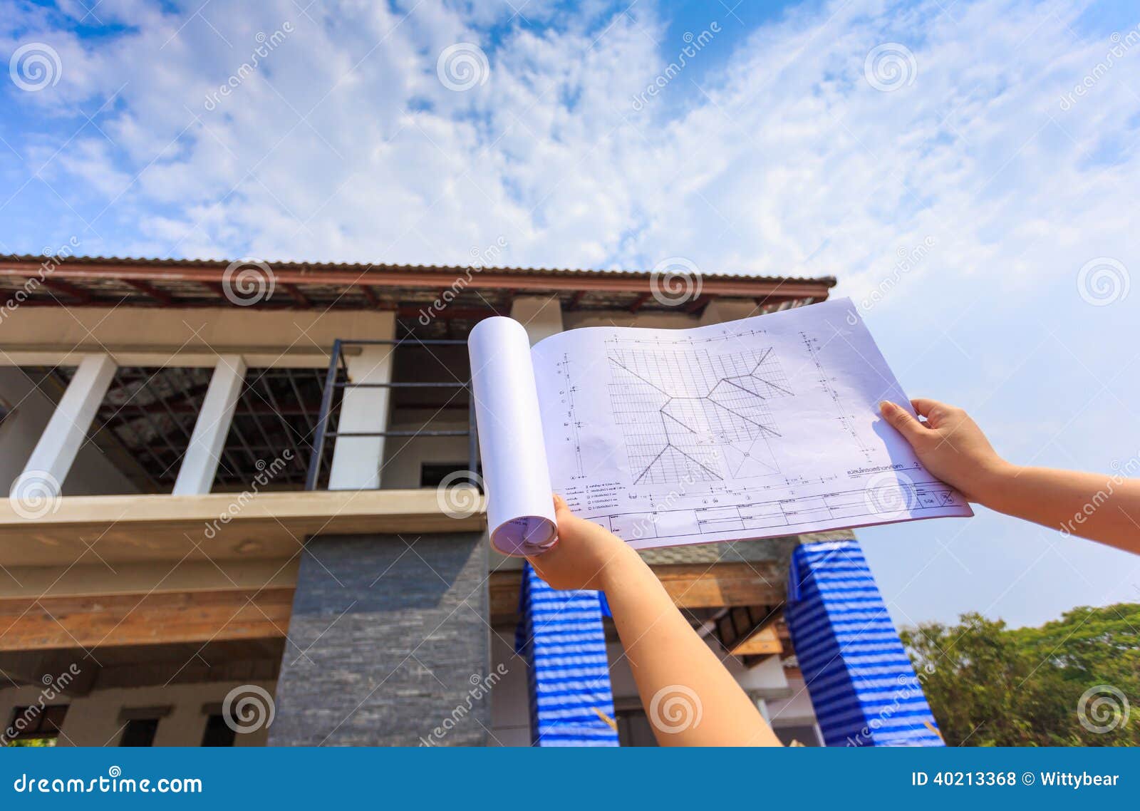 Architecture Drawings in Hand on Big House Building Stock Photo - Image ...
