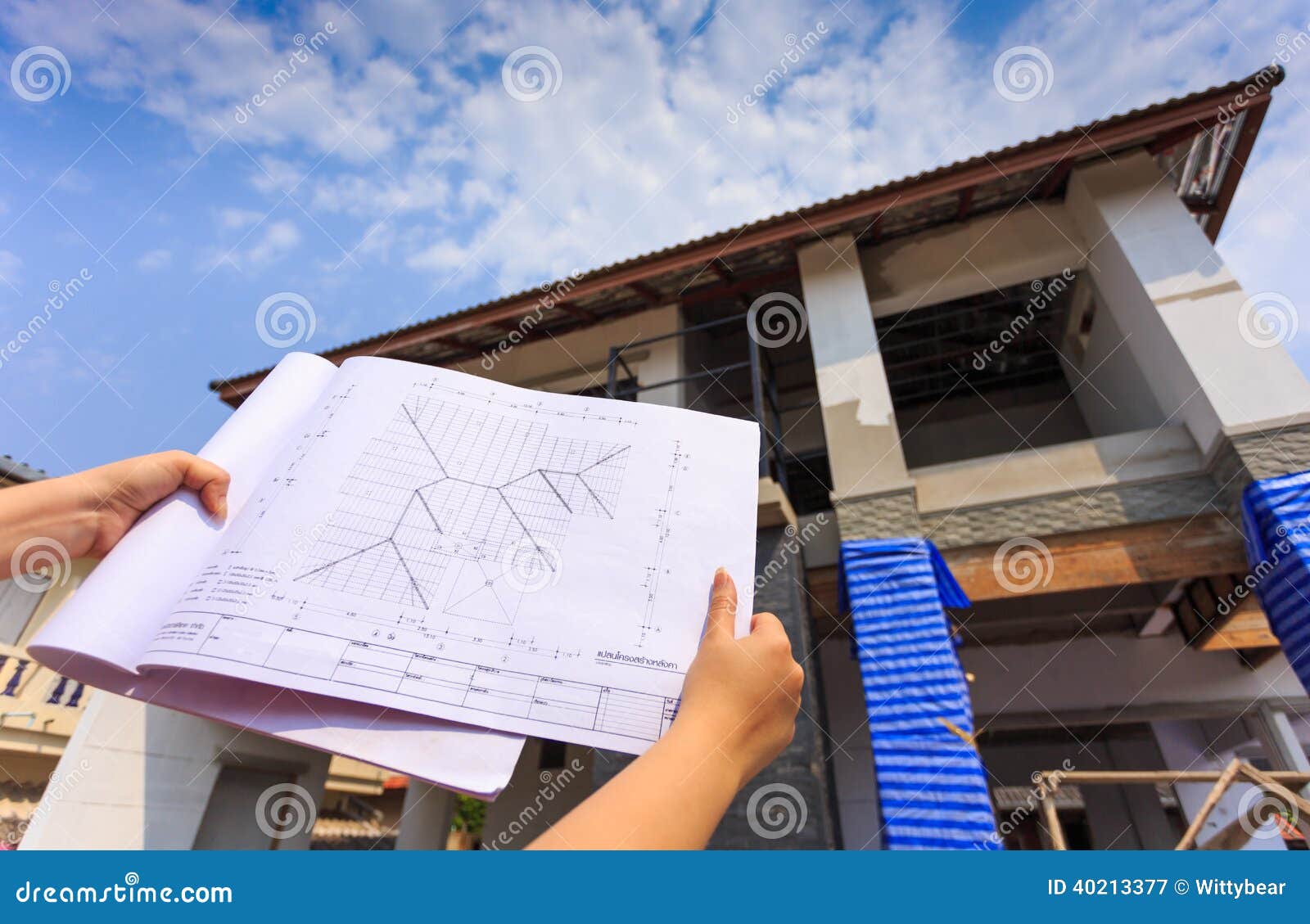 Architecture Drawings in Hand on Big House Building Stock Image - Image ...
