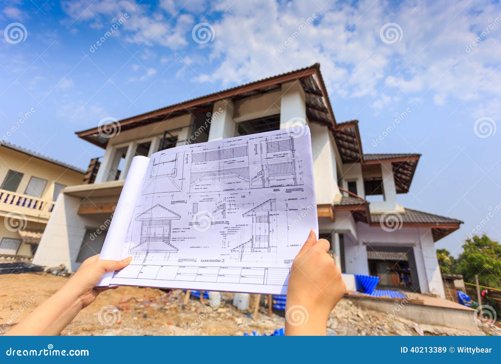 Architecture Drawings in Hand on Big House Building Stock Image - Image ...