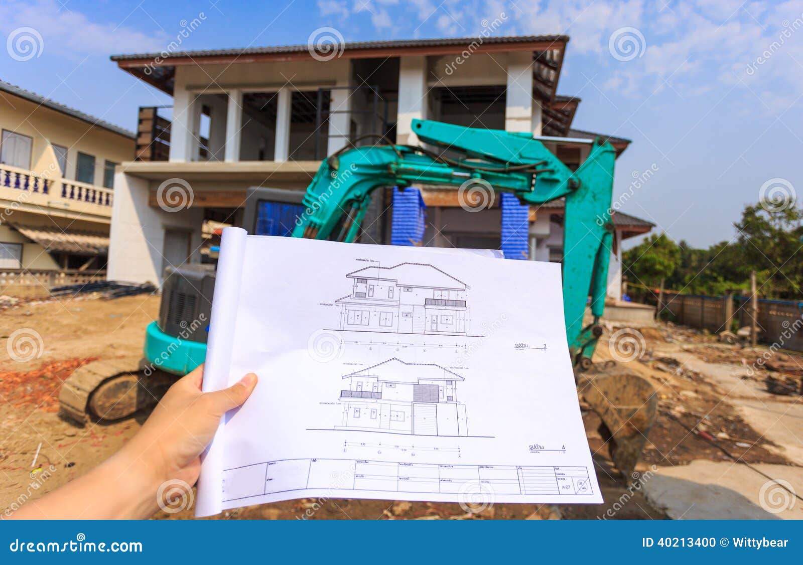Architecture Drawings in Hand on Big House Building Stock Photo - Image ...