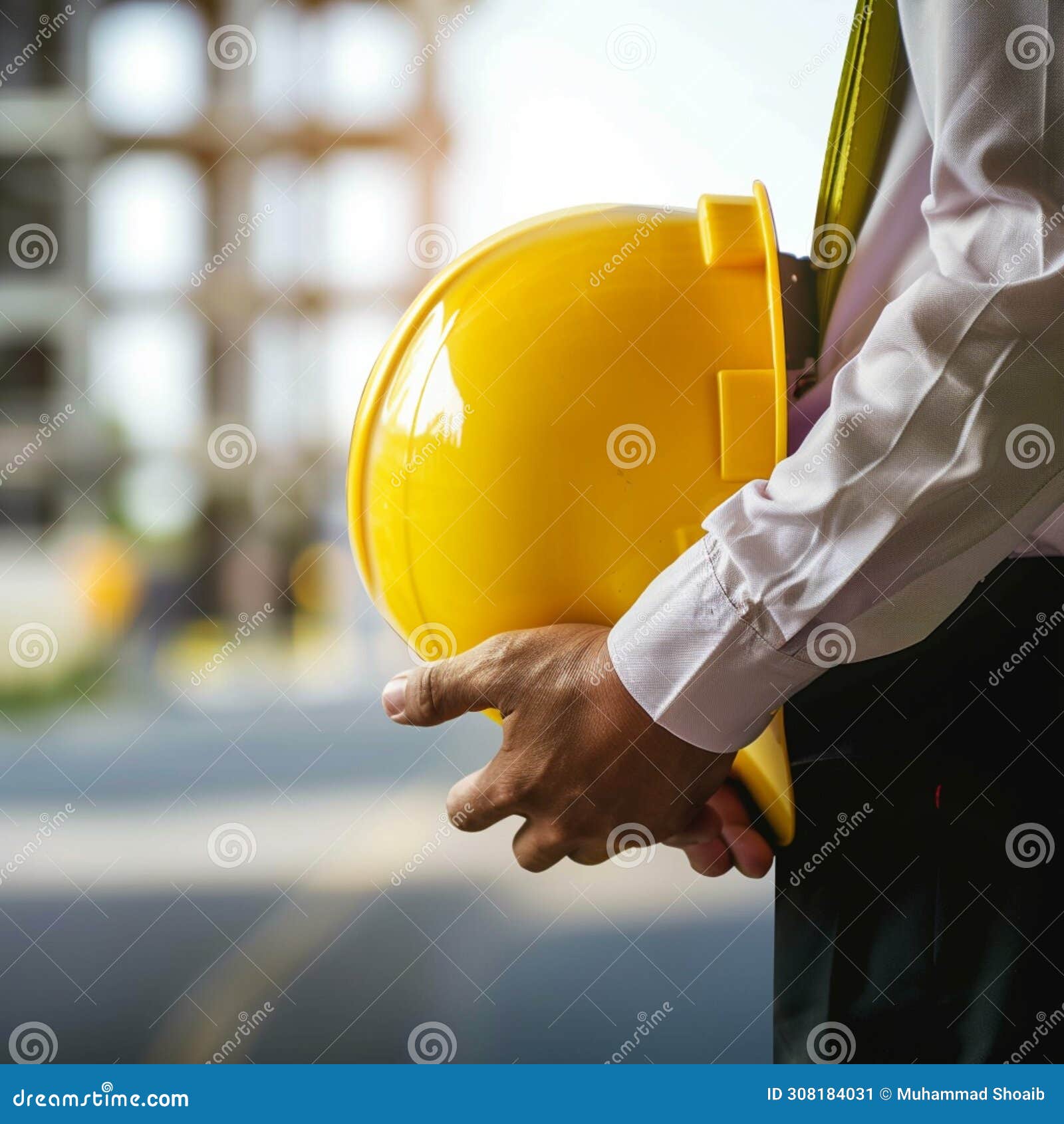 Engineer Holds Hard Hat Helmet, Prioritizing Safety On Construction ...