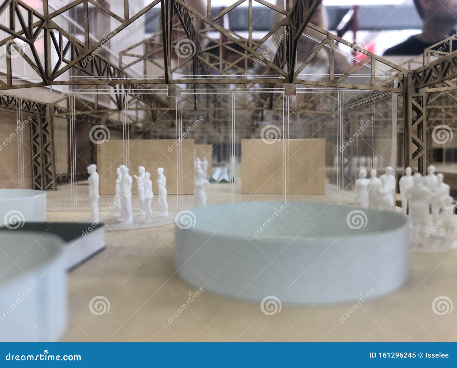 Architecture Mockup Of A Huge Workplace With Miniature People Inside ...
