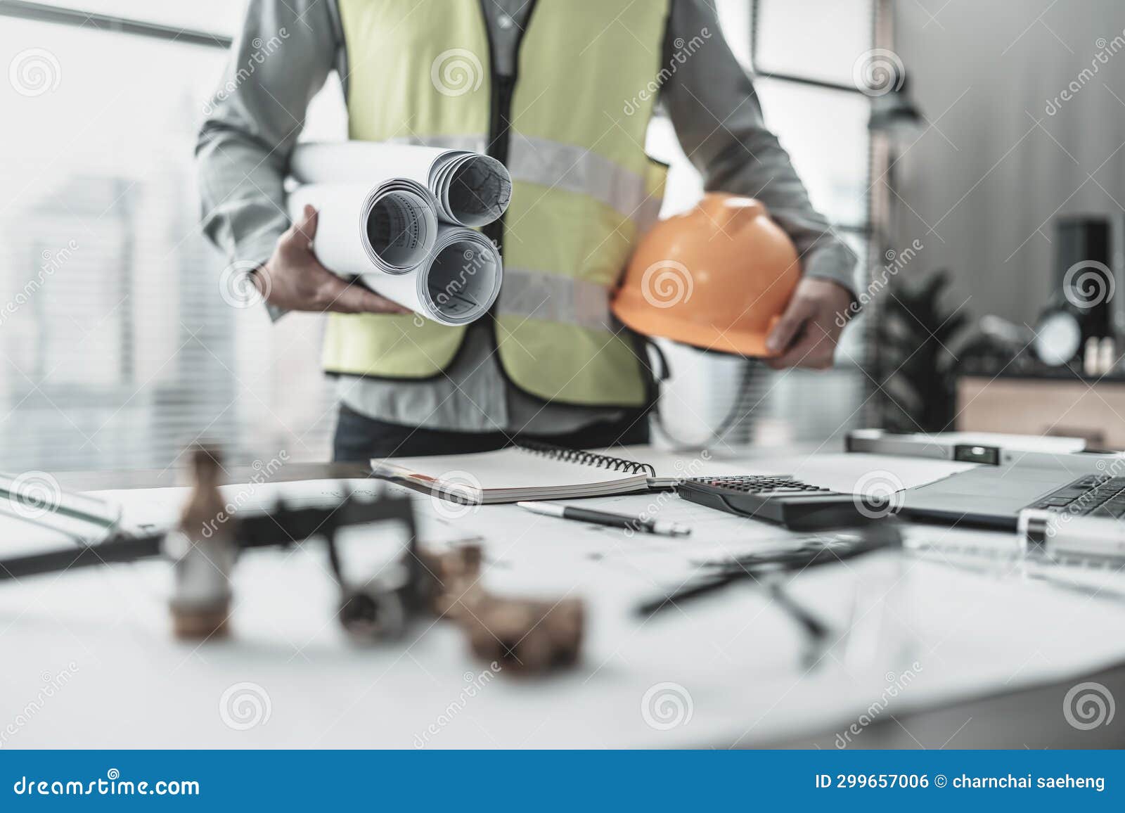 Architect, Engineer Holding Paper Roll Drawings and Safety Hat in the ...