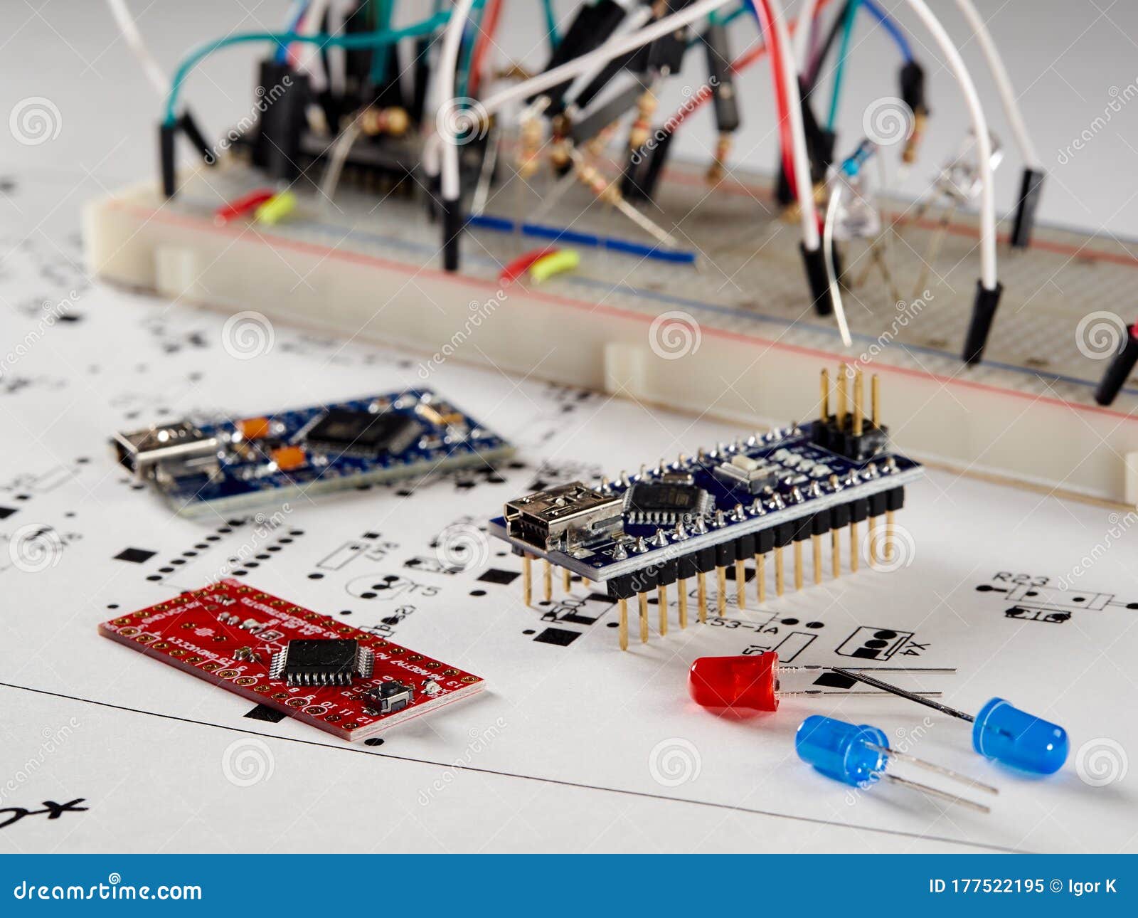 Arduino And Programmers With Peripherals And Expansion Boards Lie On A Gray Background Do It
