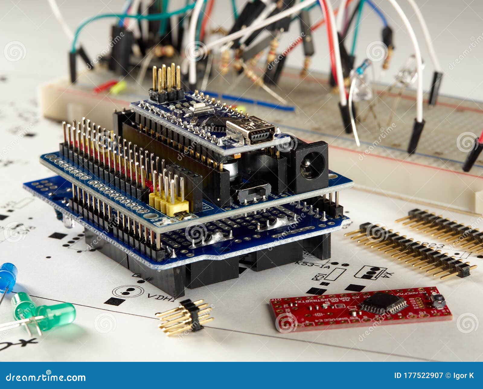 Arduino And Programmers With Peripherals And Expansion Boards Lie On A Gray Background Do It