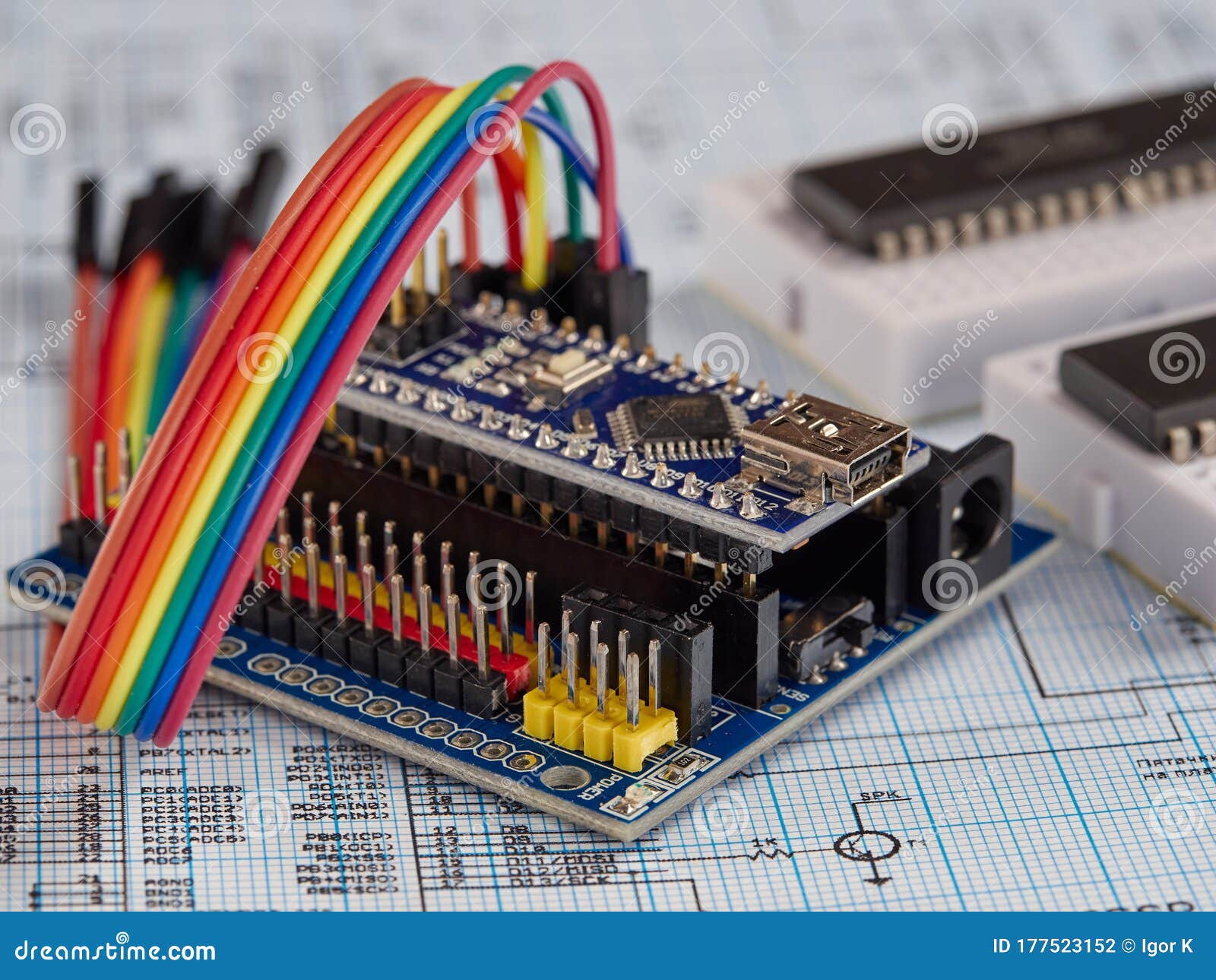 Arduino And Programmers With Peripherals And Expansion Boards Lie On A