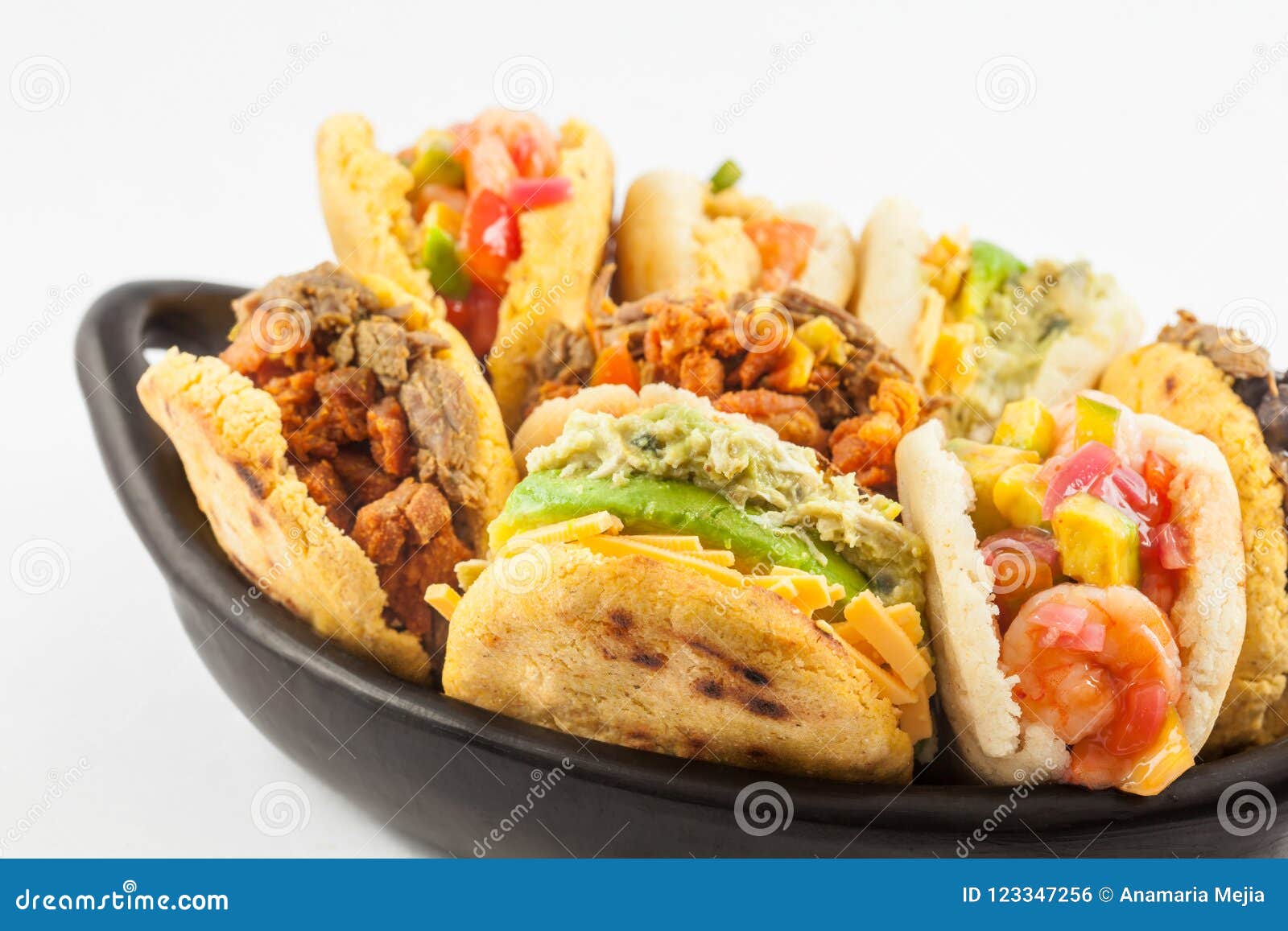 Arepas with Assorted Fillings Served in a Black Ceramic Dish Stock ...