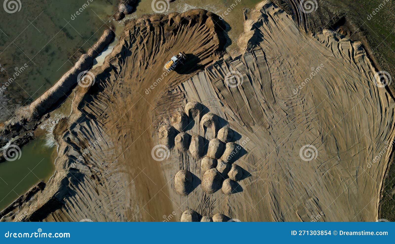Arial View of Open Pit Sand Mine. a Front Loader Loads Sand from Piles ...