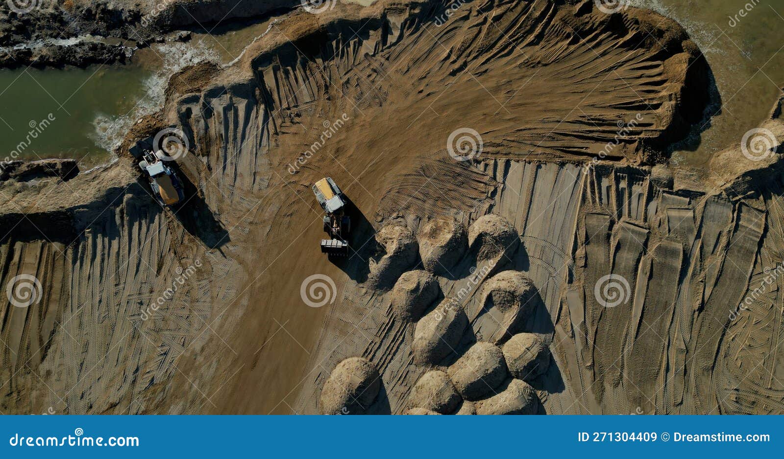 Arial View of Open Pit Sand Mine. a Front Loader Loads Sand from Piles ...