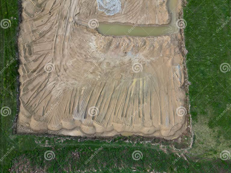 Arial View of Open Pit Sand Mine. a Front Loader Loads Sand from Piles ...