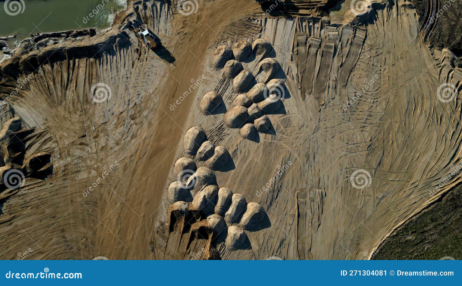 Arial View of Open Pit Sand Mine. a Front Loader Loads Sand from Piles ...