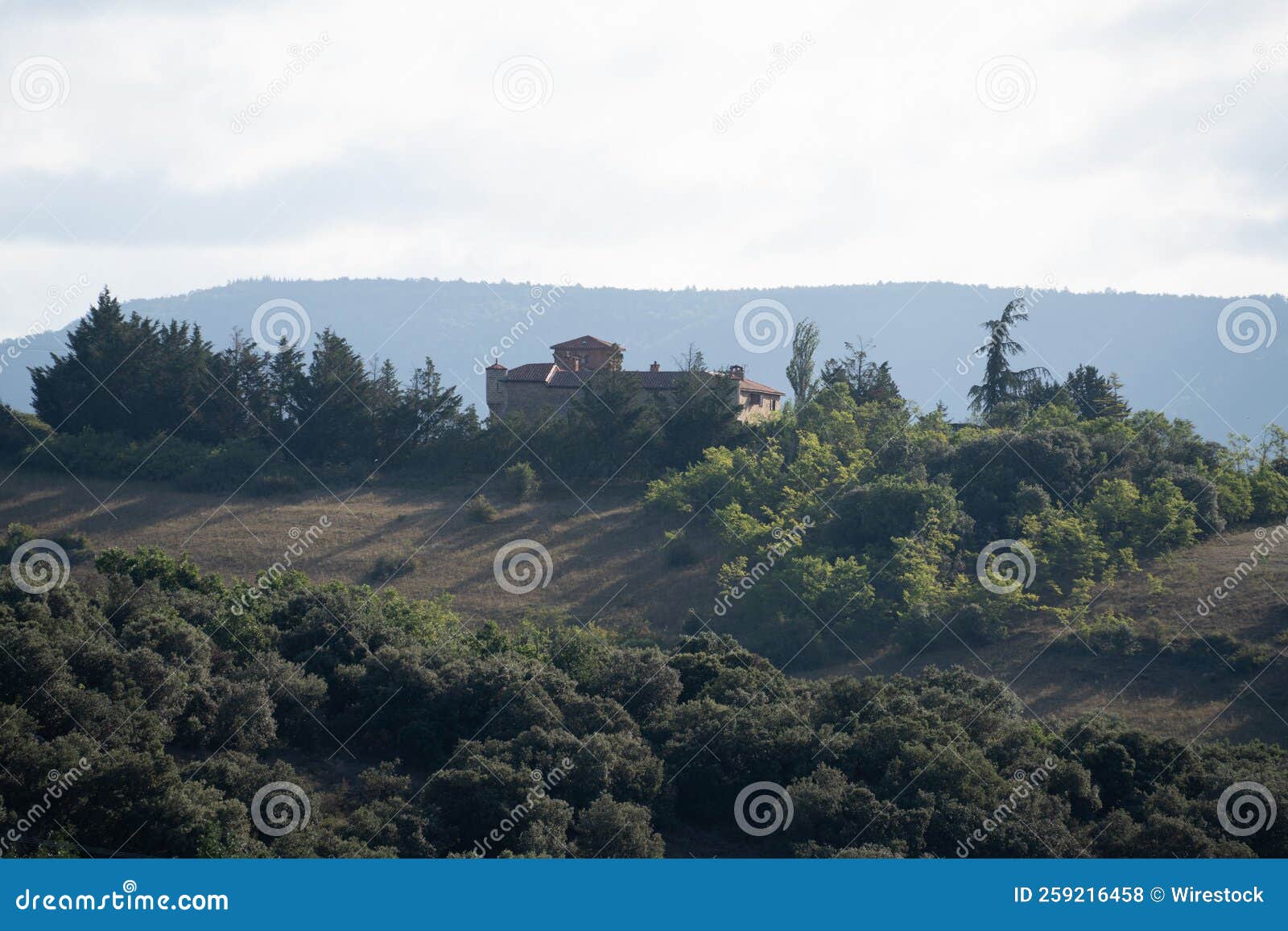 Ariel View of a Valley with an Old Building and Hills in the Horizon ...