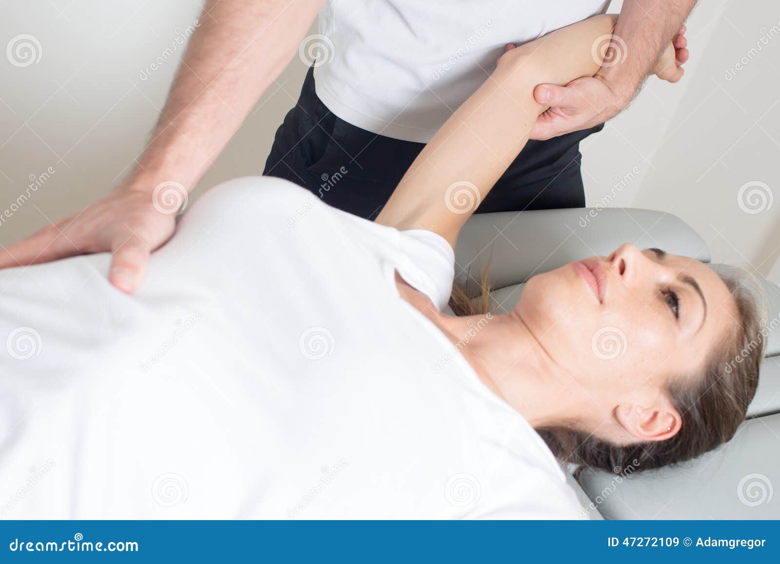 Arm stretching at doctors stock image. Image of attractive - 47272109