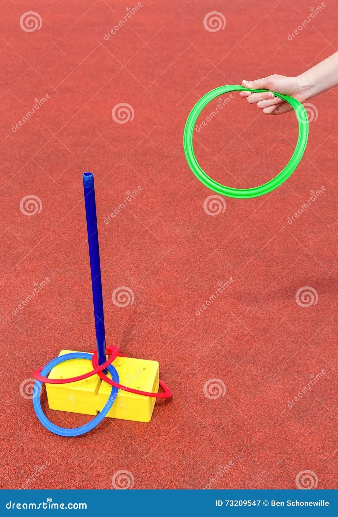 Arm Throwing Colored Rings Around Pole Stock Image - Image of ...