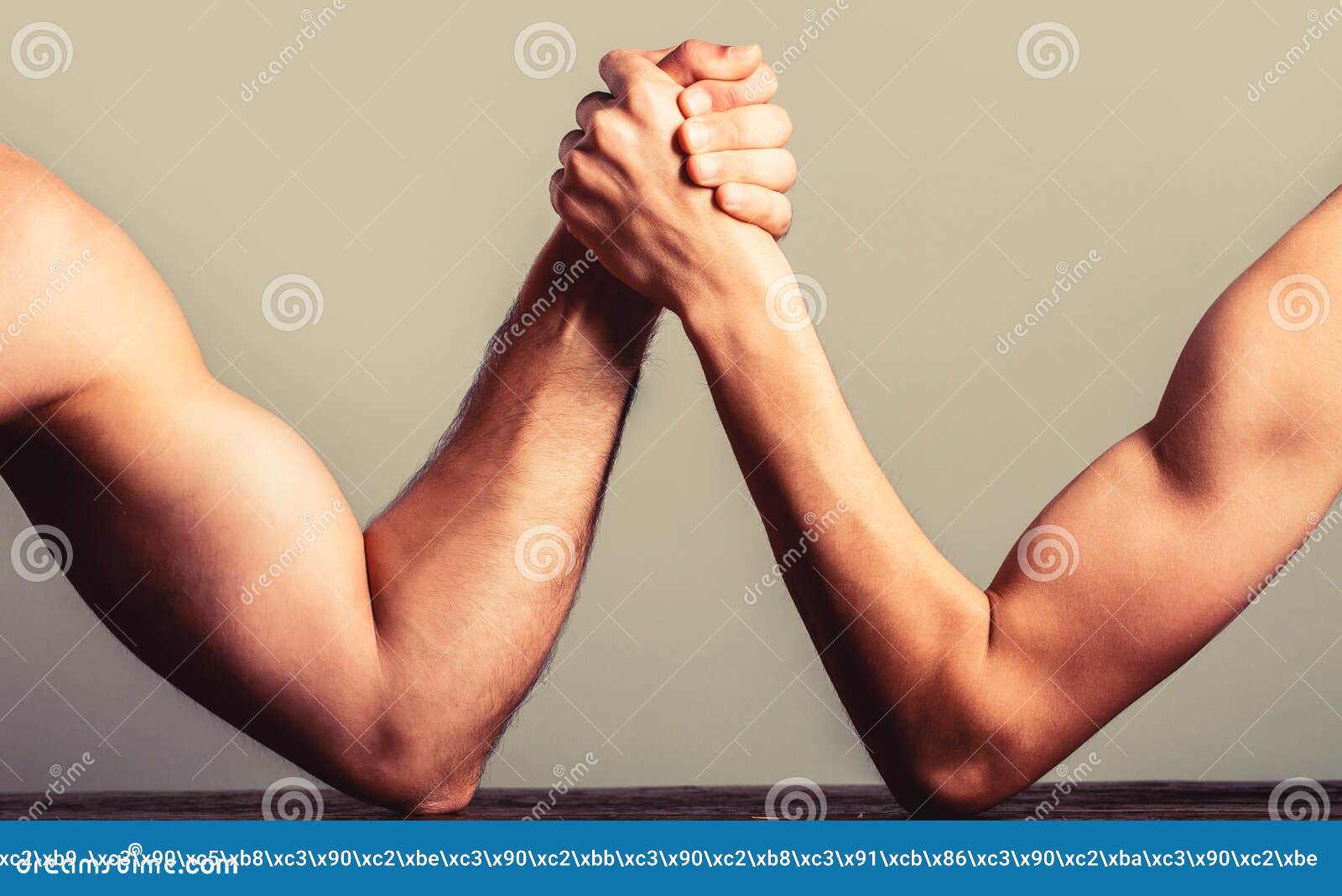 Arm Wrestling Thin Hand and a Big Strong Arm in Studio. Two Man& X27;s ...
