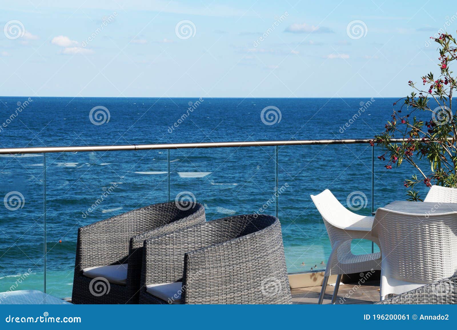 Armchairs and a Table for Relaxing on the Patio Overlooking the Sea ...