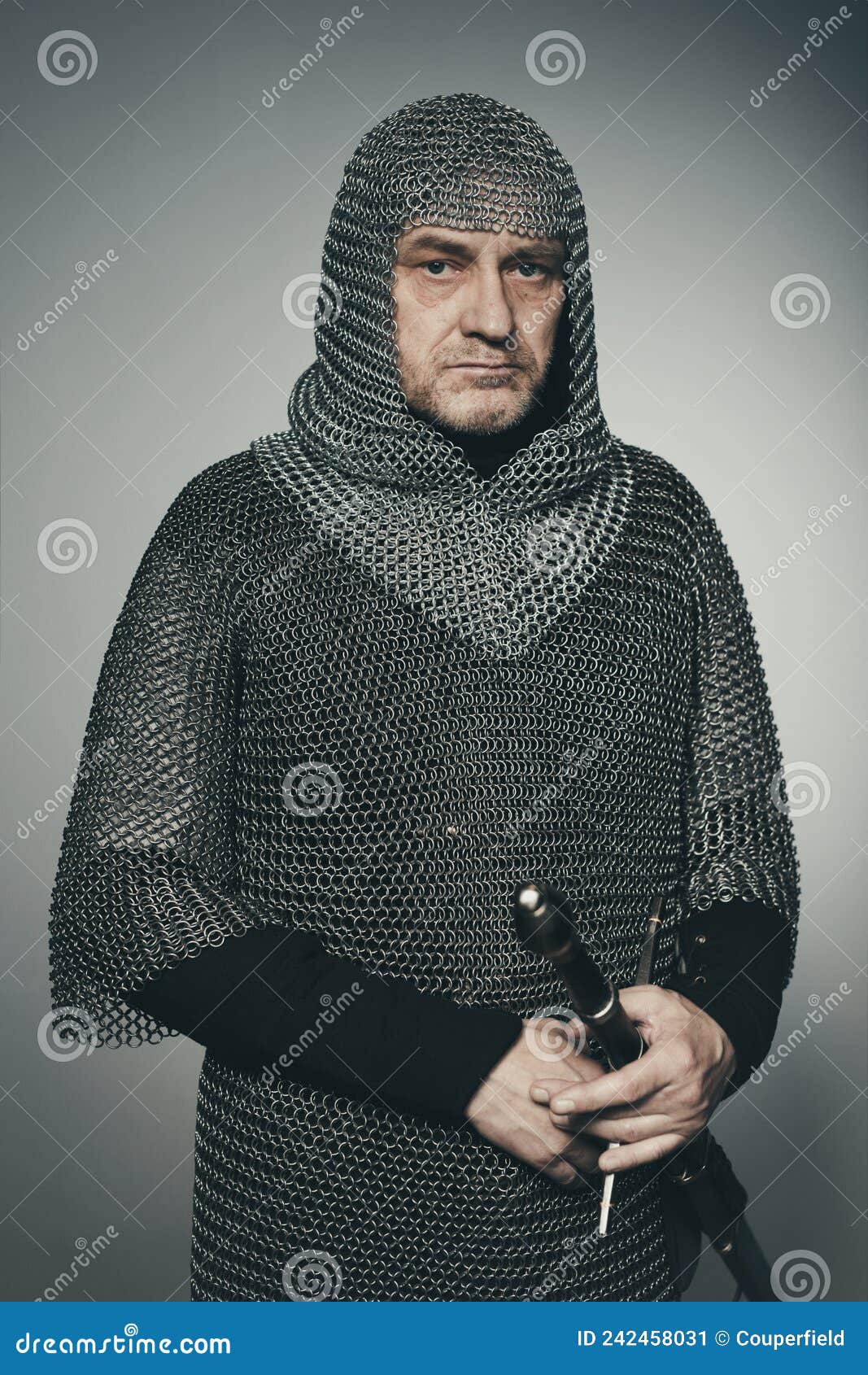 Armed Man in Chain Armor with Sword Posing for Portrait in Studio Stock ...