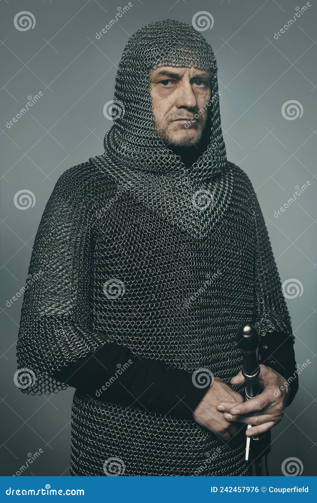 Armed Man in Chain Armor with Sword Posing for Portrait in Studio Stock ...